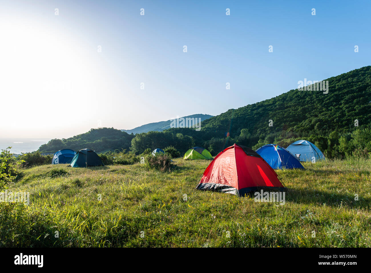 Many tents in the mountain.. Outdoor concept. Sunshine morning in the ...