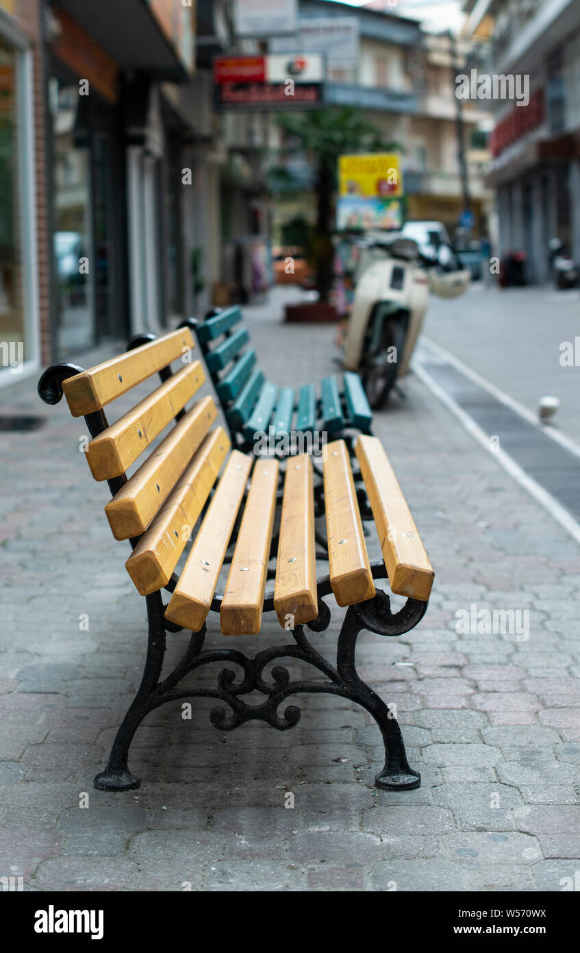 Wooden Bench on the street. No people. Shopping street Stock Photo - Alamy