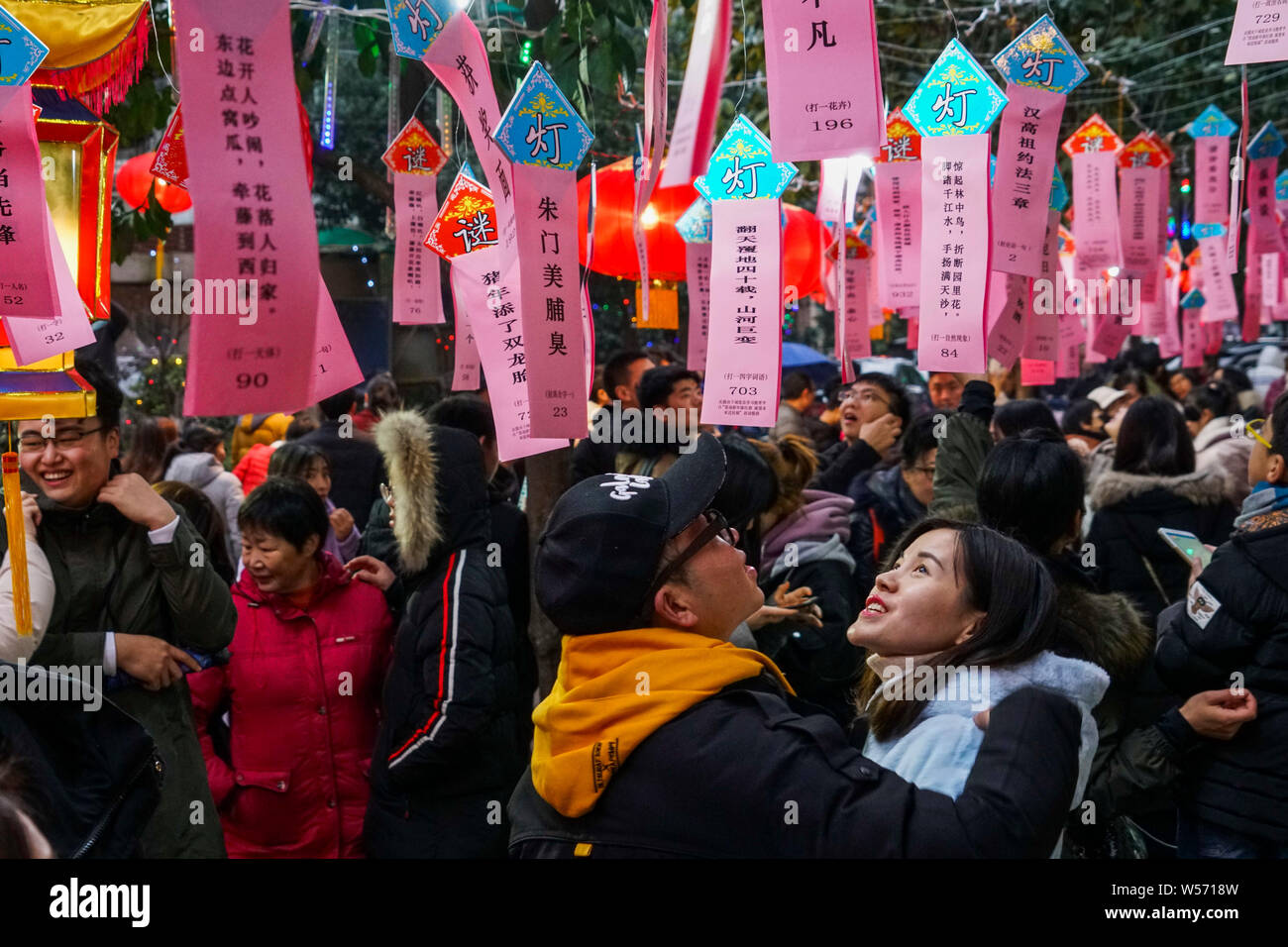 Citizens and tourists try to solve the lantern riddles to celebrate the ...