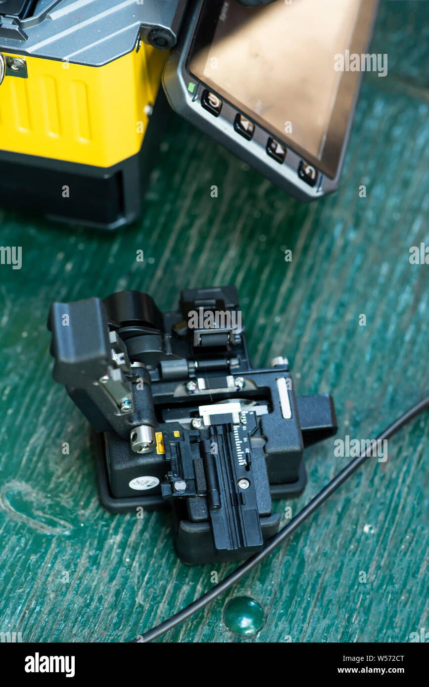 Device for mounting optical cable. Optical internet Technology concept ...