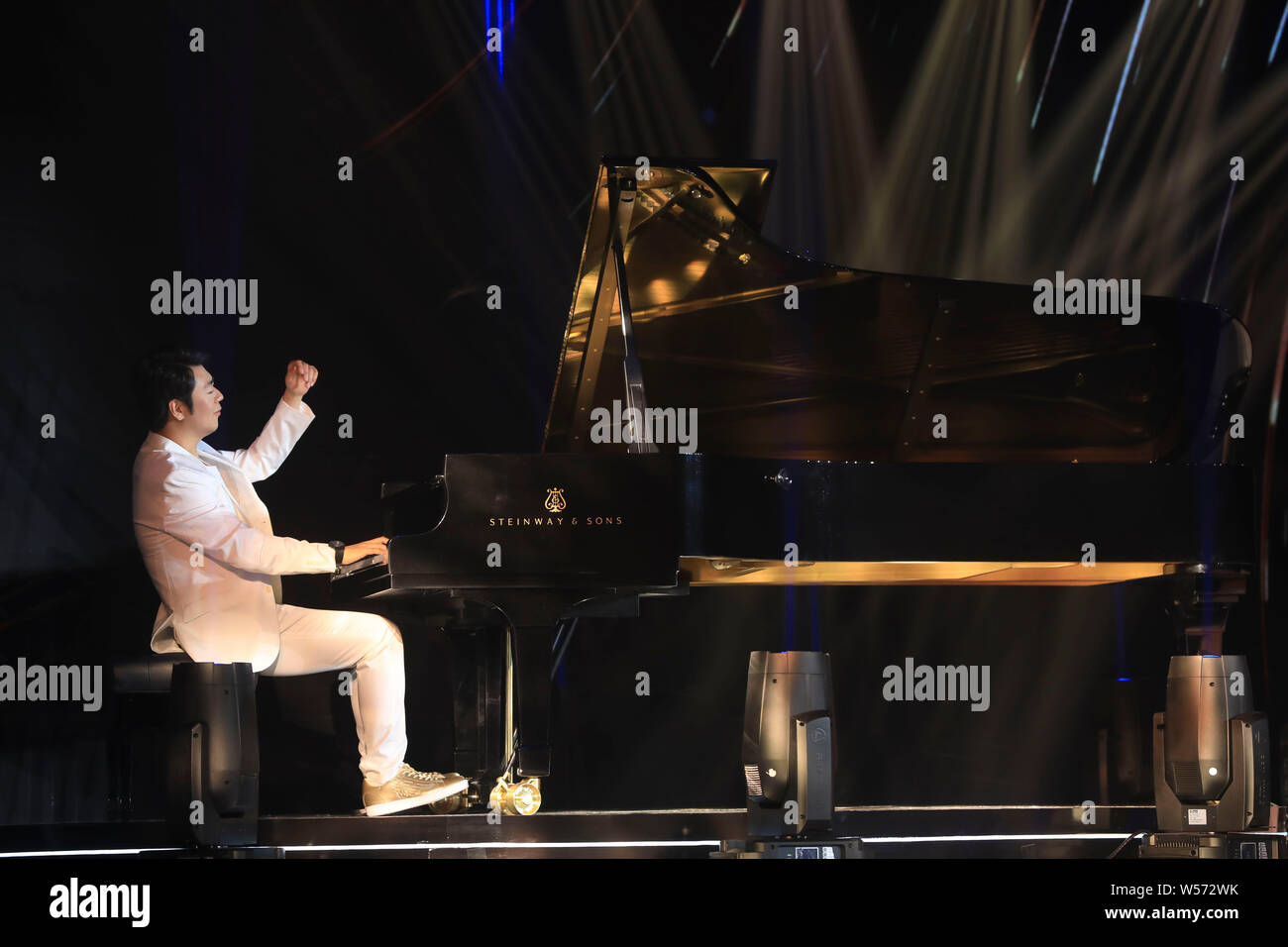 Chinese pianist Lang Lang performs at a launch ceremony for his new ...