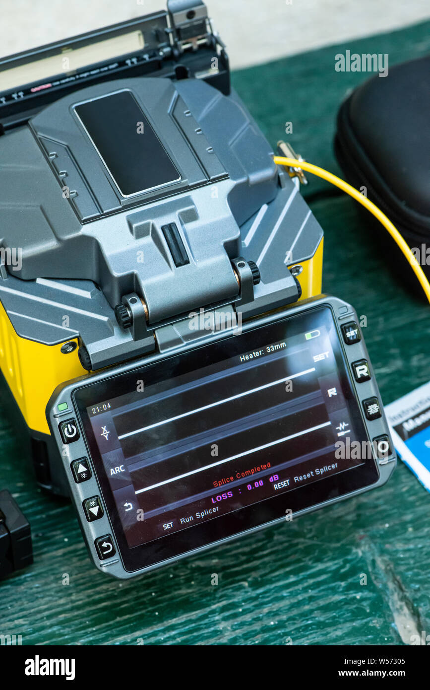 Device for mounting optical cable. Optical internet Technology concept ...