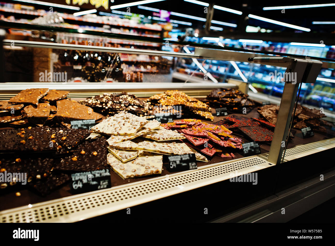 Chocolate tiles sweets store on showcase in factory store Stock Photo ...
