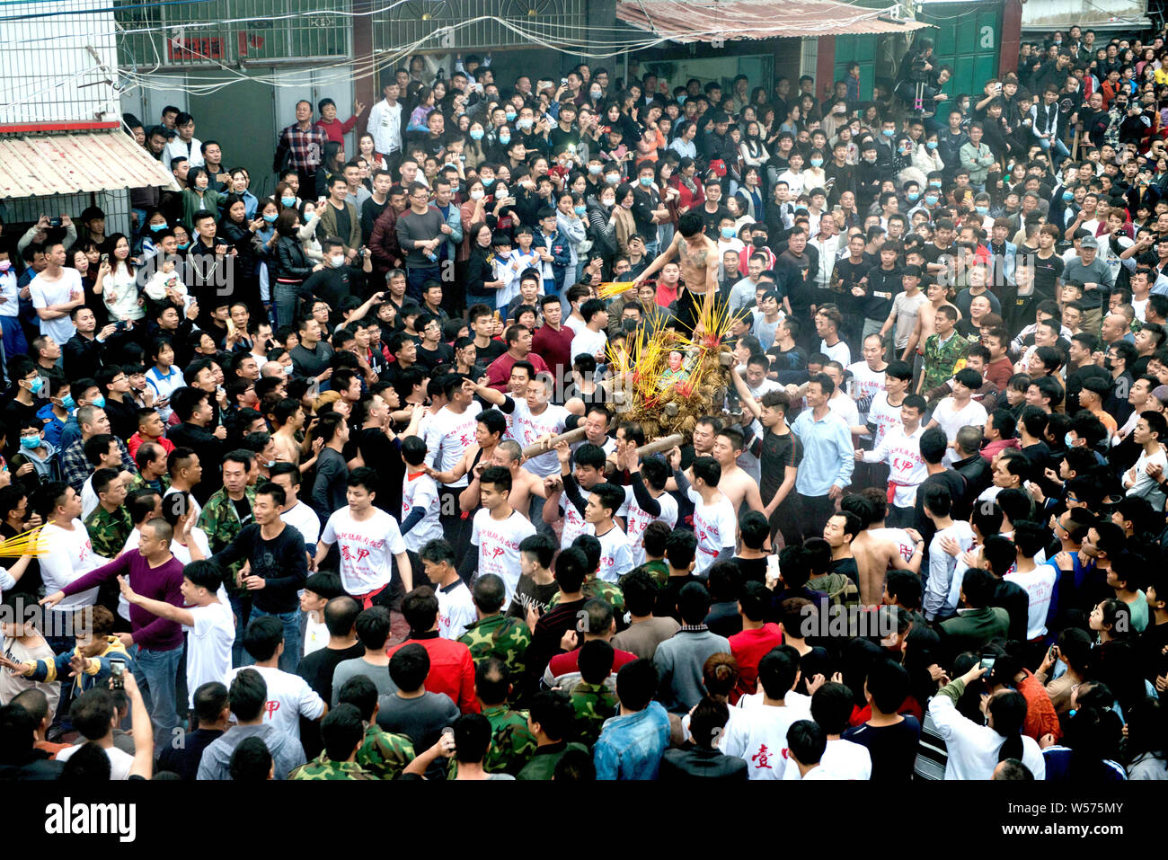 Villagers take part in the traditional "tuoshenou" parade in Yanzhao ...