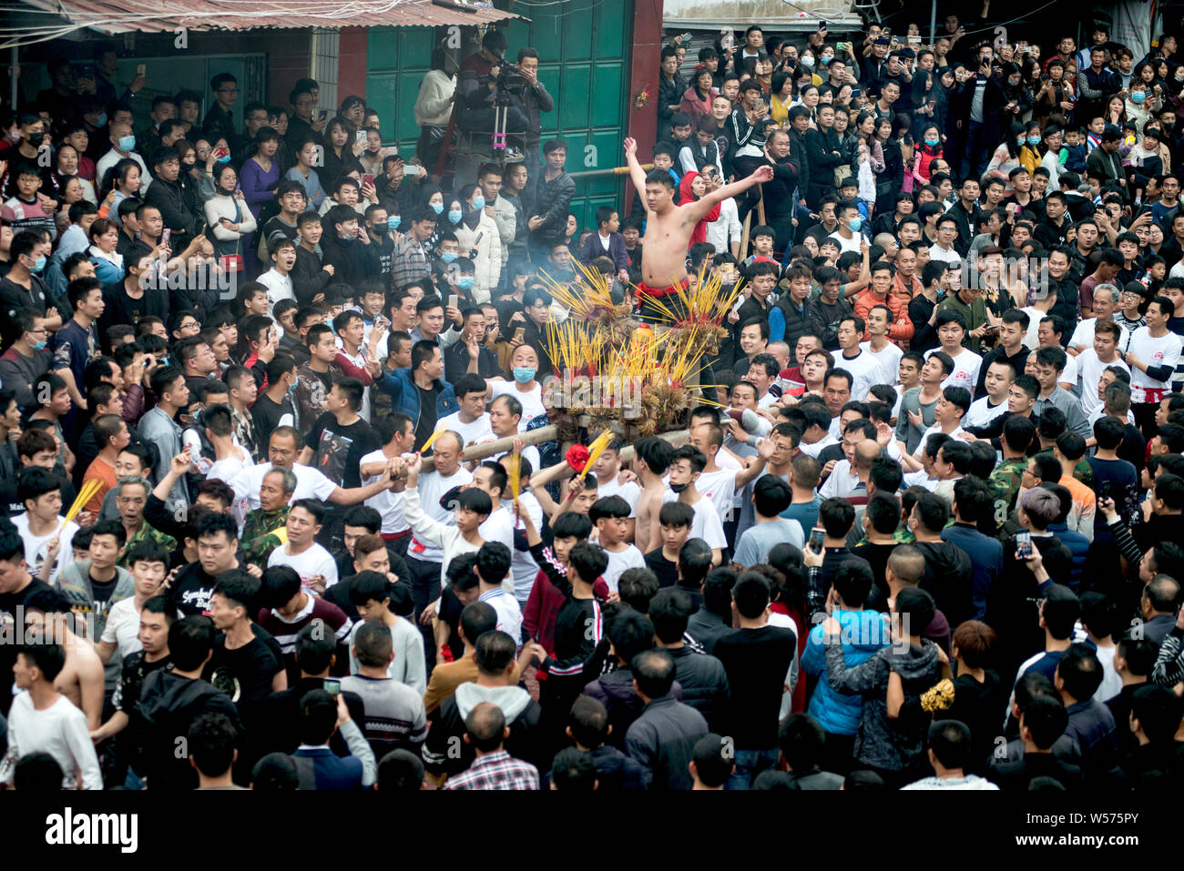 Villagers take part in the traditional "tuoshenou" parade in Yanzhao ...