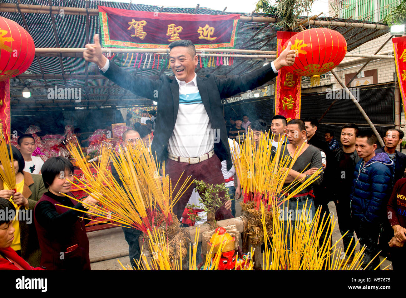 Villagers take part in the traditional "tuoshenou" parade in Yanzhao ...