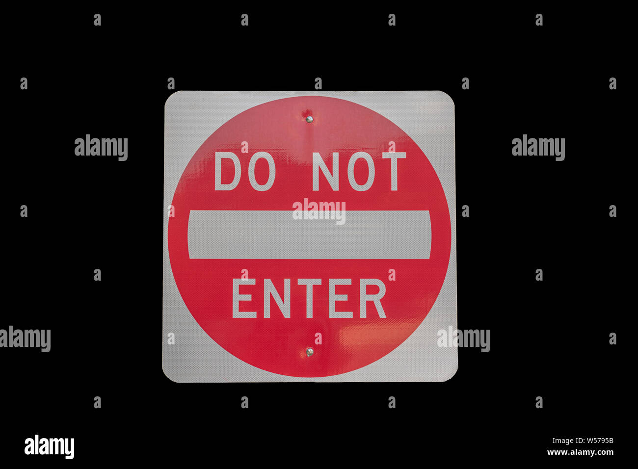 Red and white do not enter sign isolated on black Stock Photo - Alamy