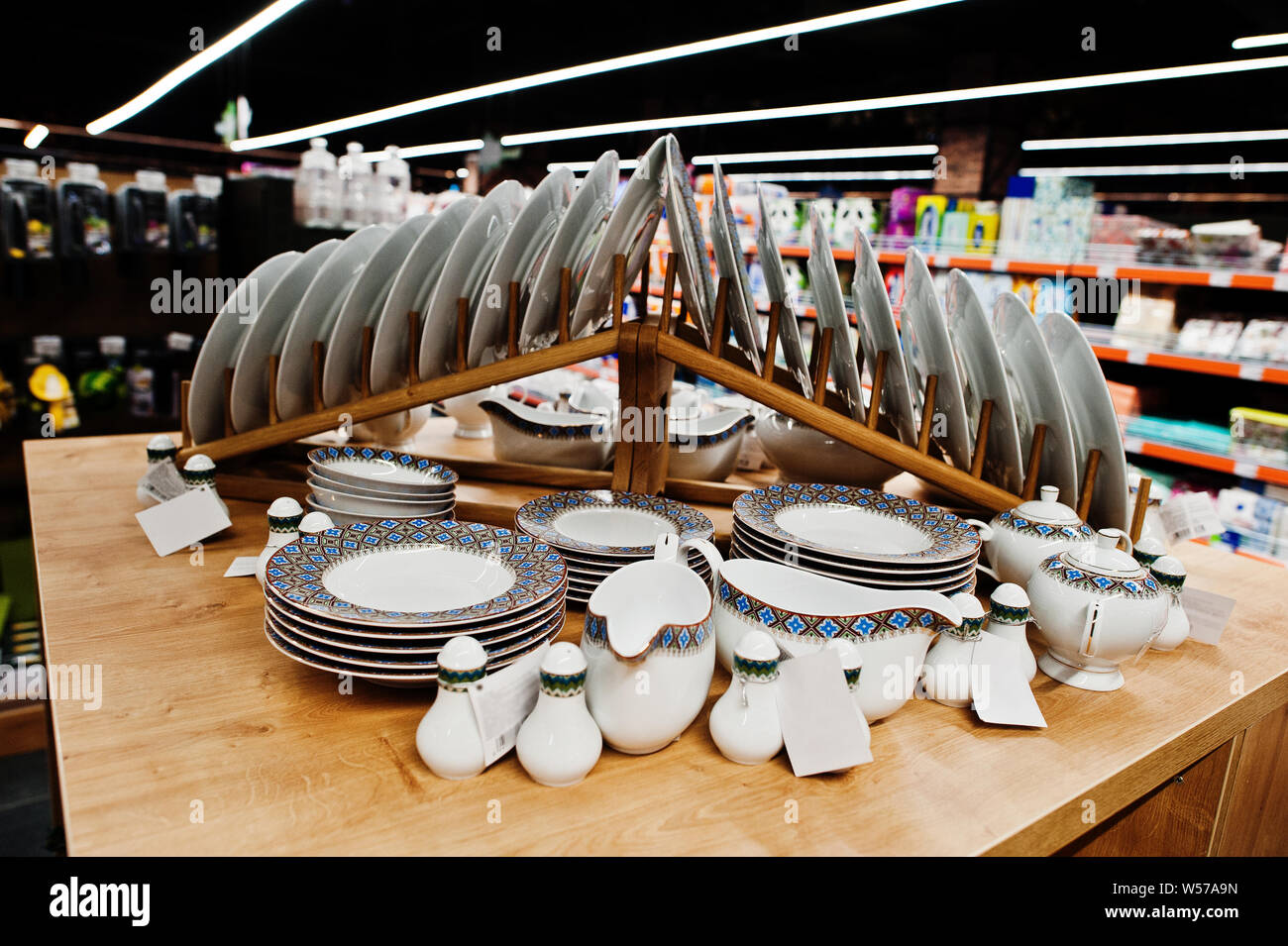 Set of dishes on supermarket shelves for sale Stock Photo - Alamy