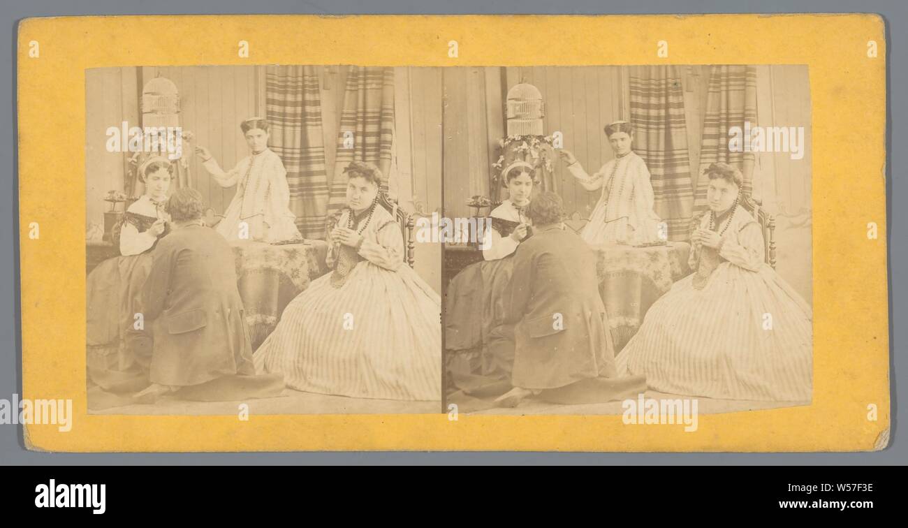 Three women and a sitting man seen on the back, living room, parlor ...