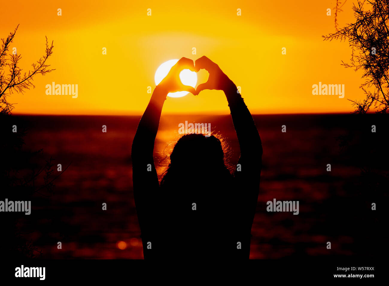 People making hearts with their hands hi-res stock photography and ...