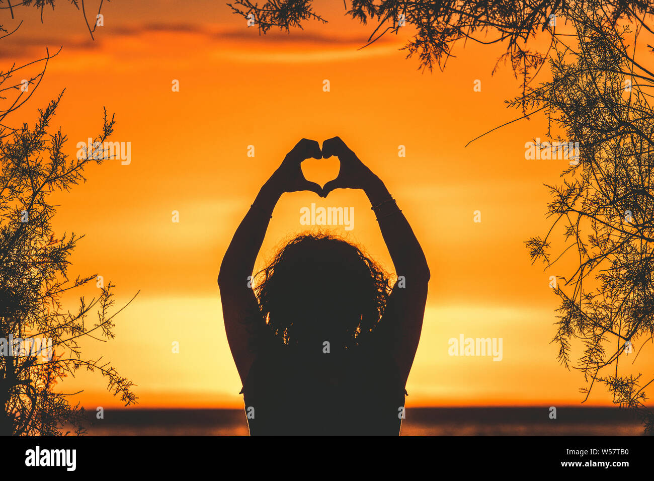 Making hearts with arms hi-res stock photography and images - Alamy