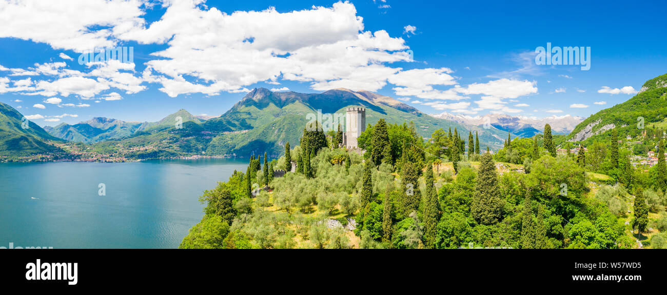 Aerial panoramic of Castle Vezio in green gardens above Varenna and ...
