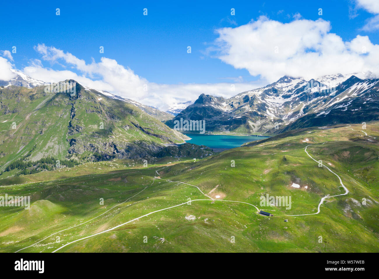 Aerial view of green pastures of Andossi and lake Montespluga ...