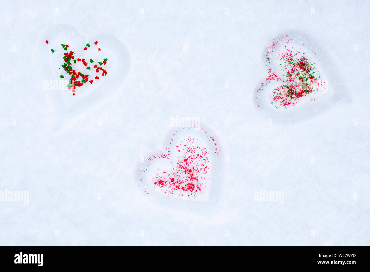 Christmas season with hearts in snow with sprinkles Stock Photo - Alamy