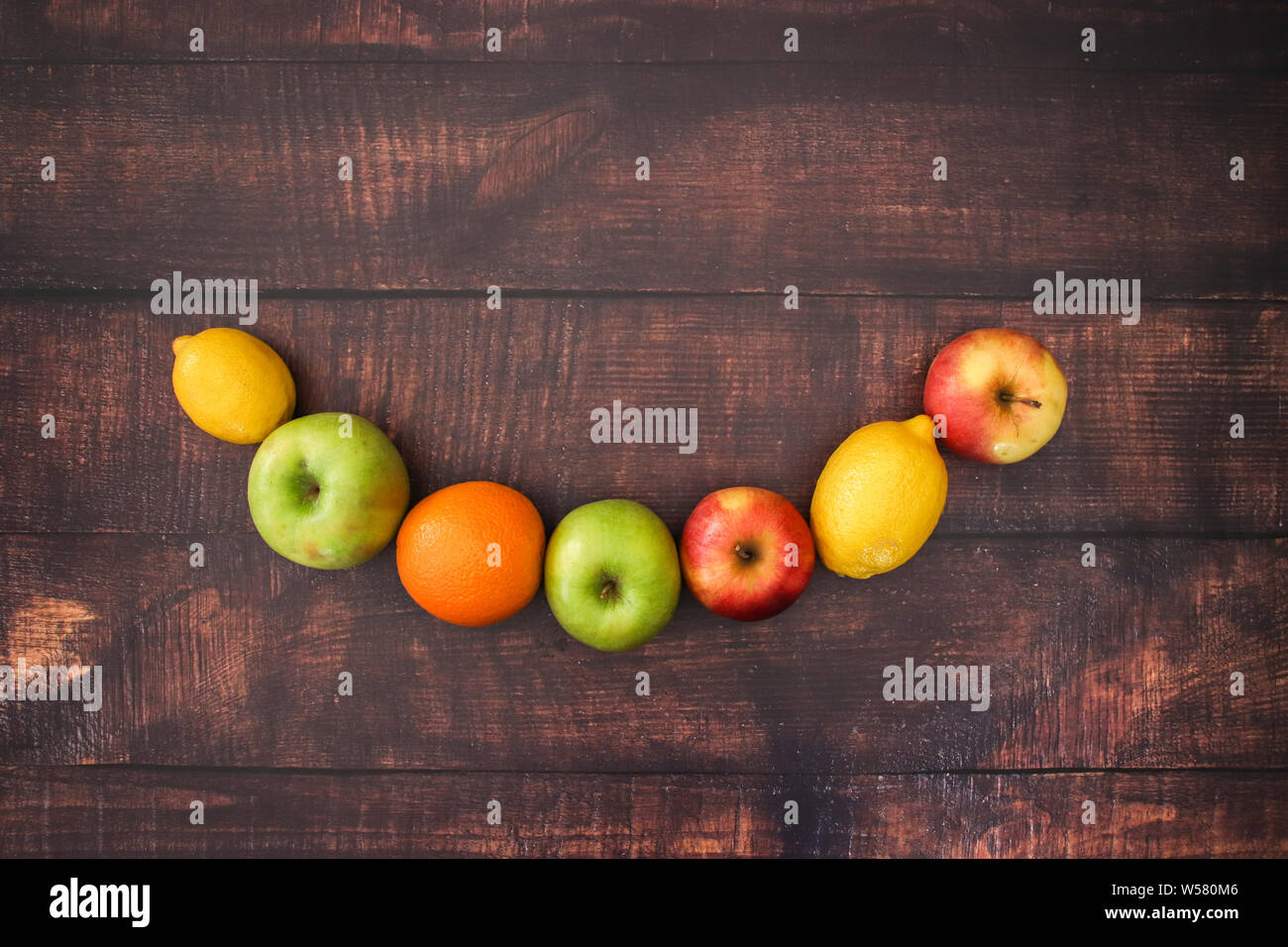 Fresh fruits on the wooden table Stock Photo - Alamy