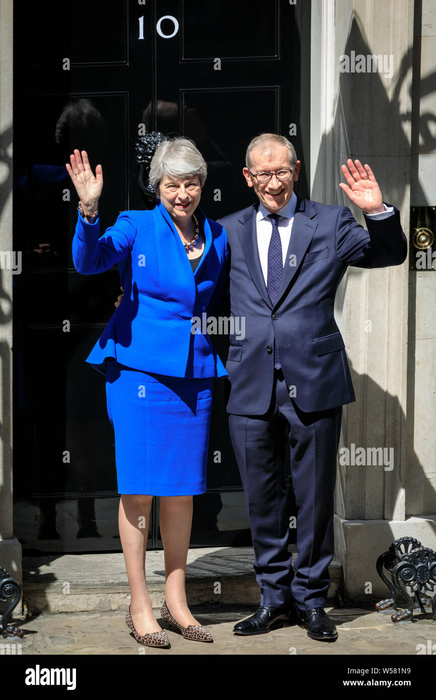 British Prime Minister Theresa May waves with her husband Philip May ...