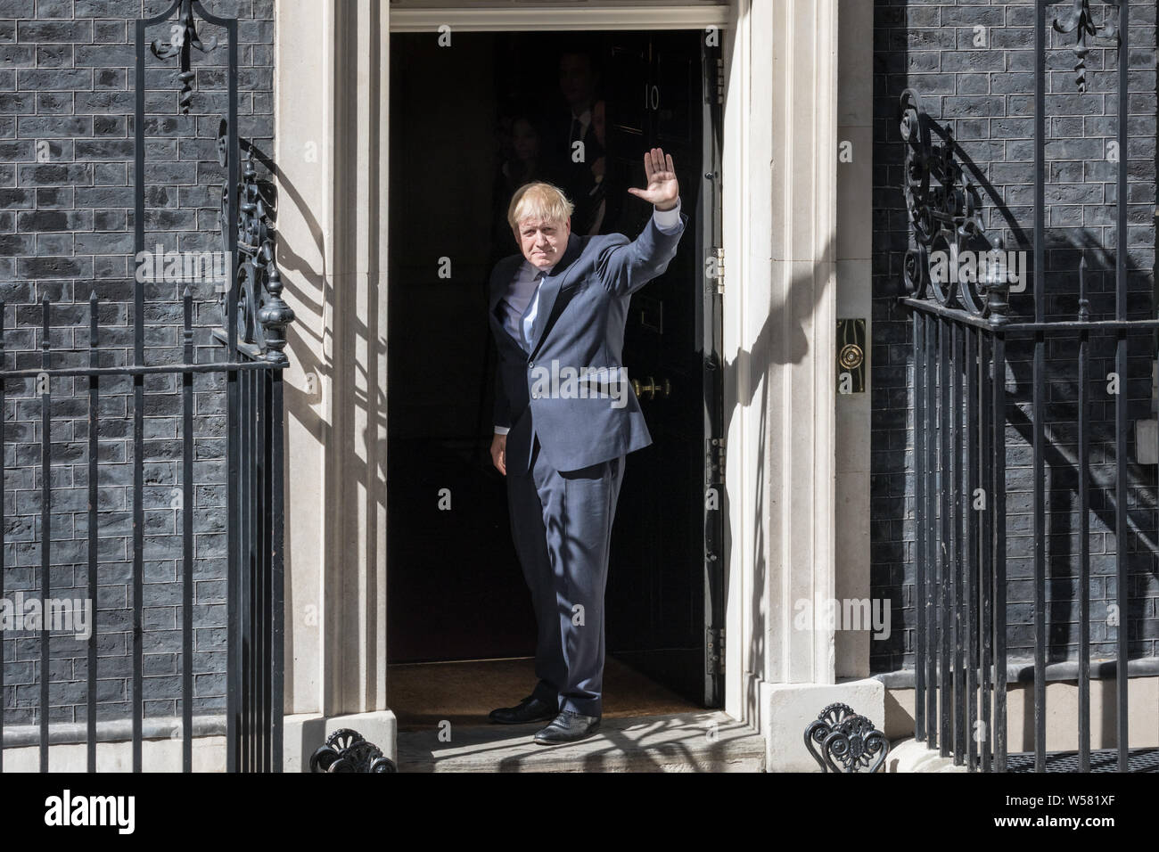 New Prime Minister Boris Johnson waves from the door outside No 10 ...