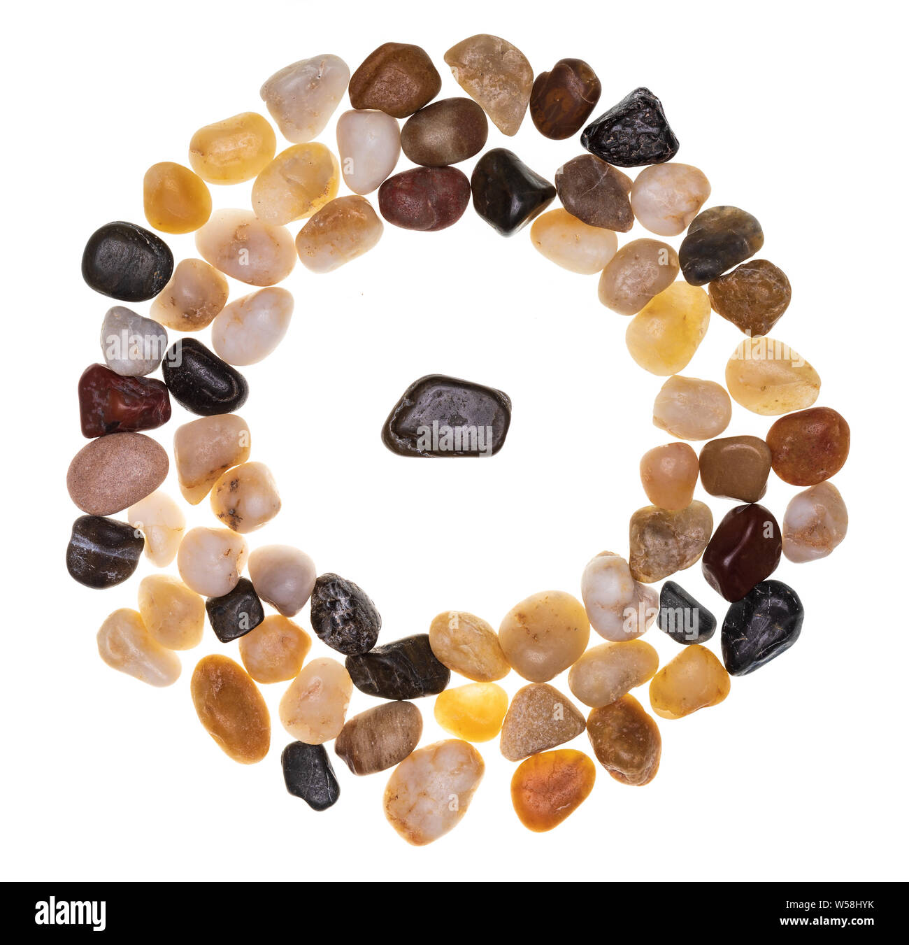 Group of multi-colored stones (multicolored) surrounding an individual ...