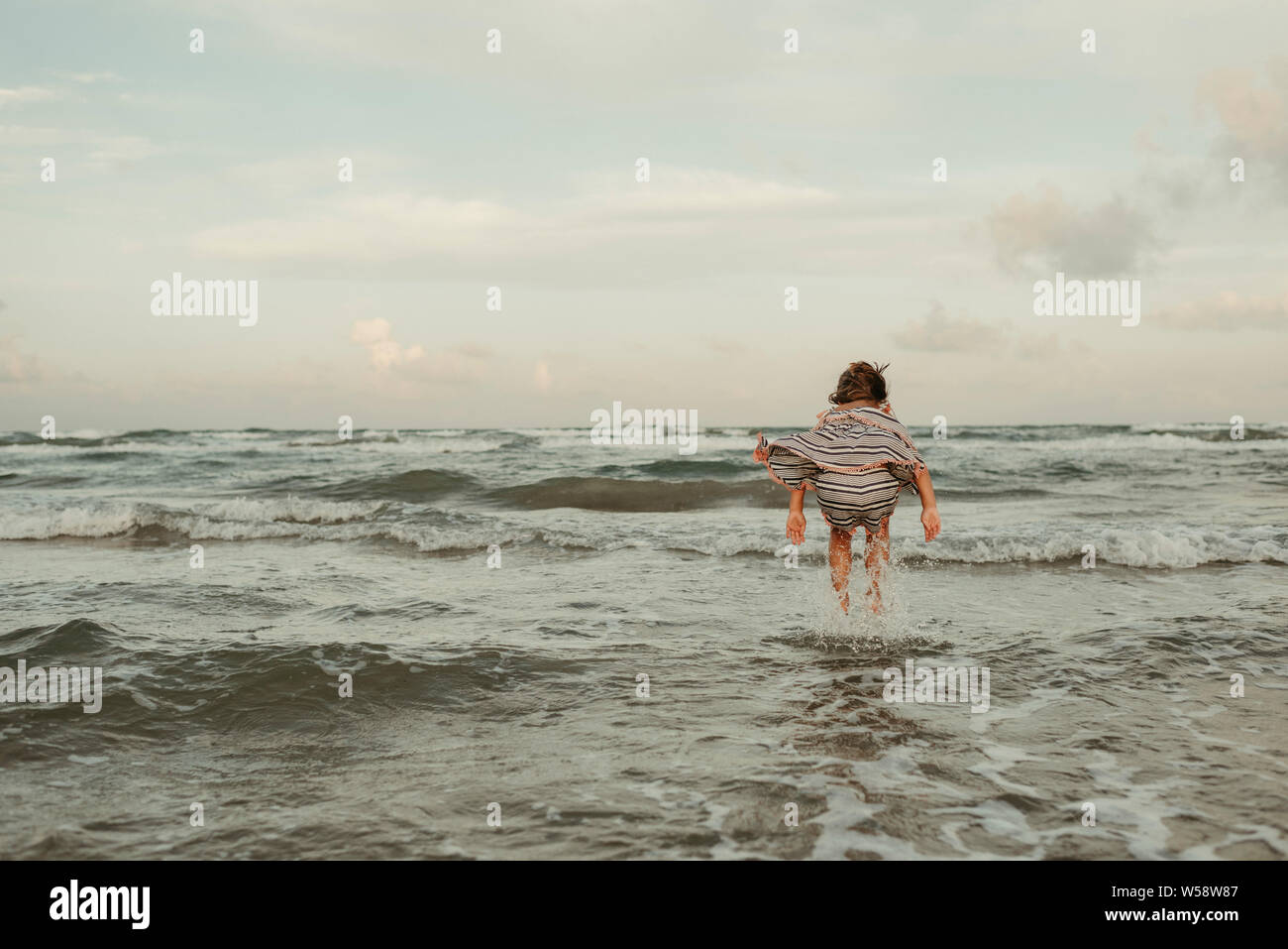 Child Playing In The Waves High Resolution Stock Photography and Images ...