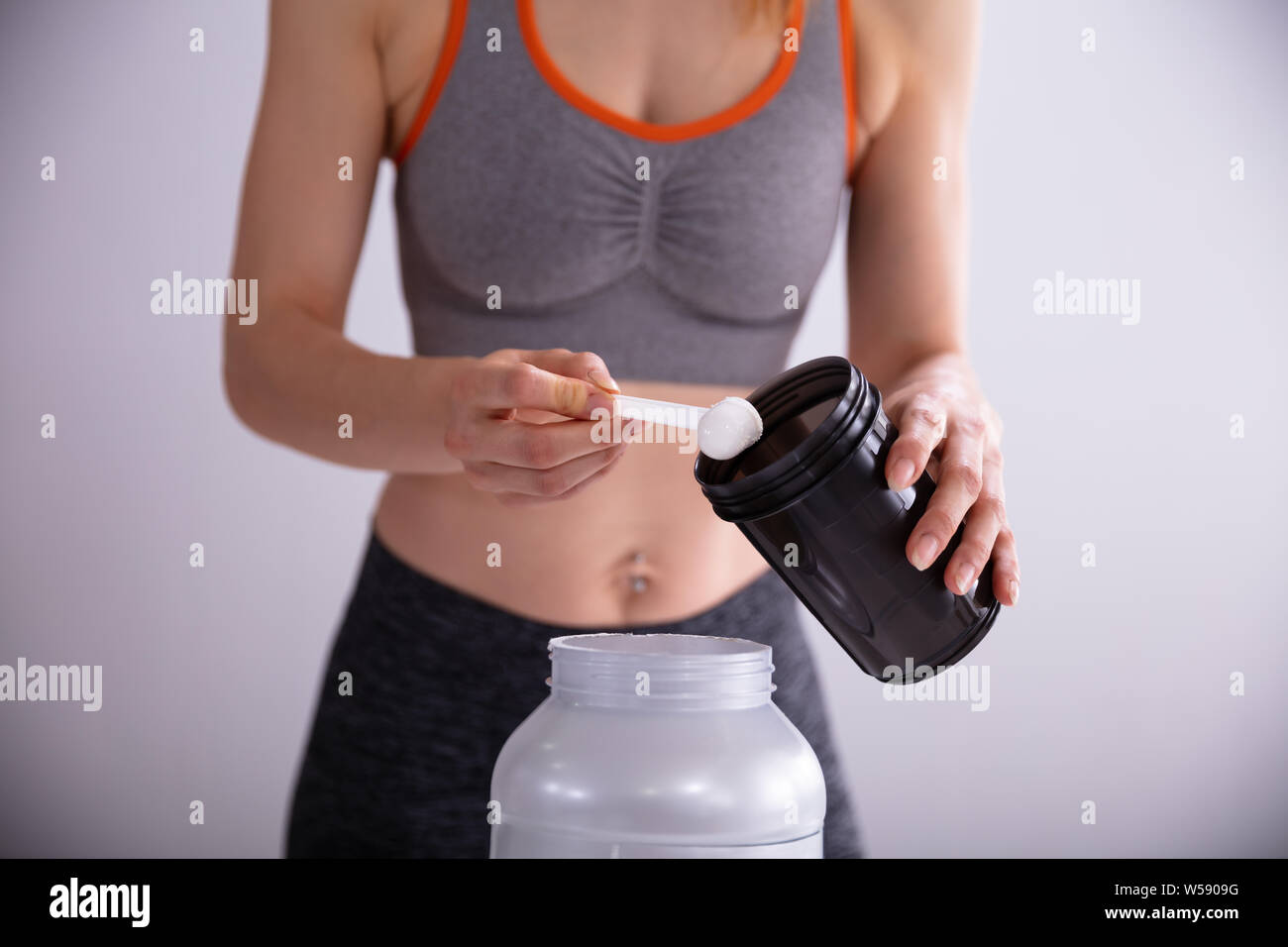 Woman making protein shake hi-res stock photography and images - Alamy