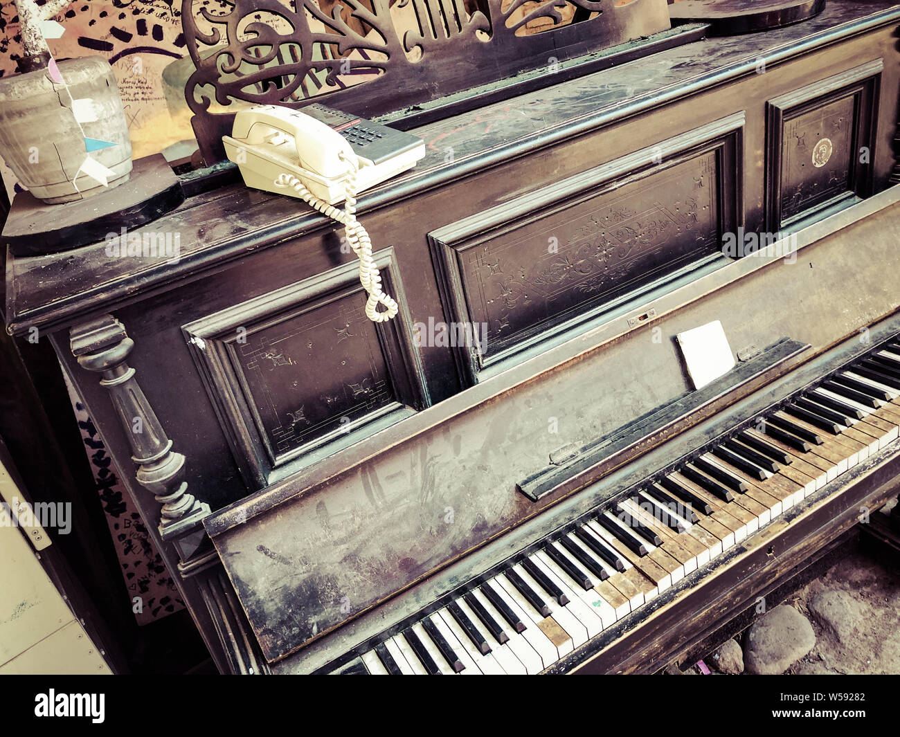 Aged black dusty piano Stock Photo - Alamy