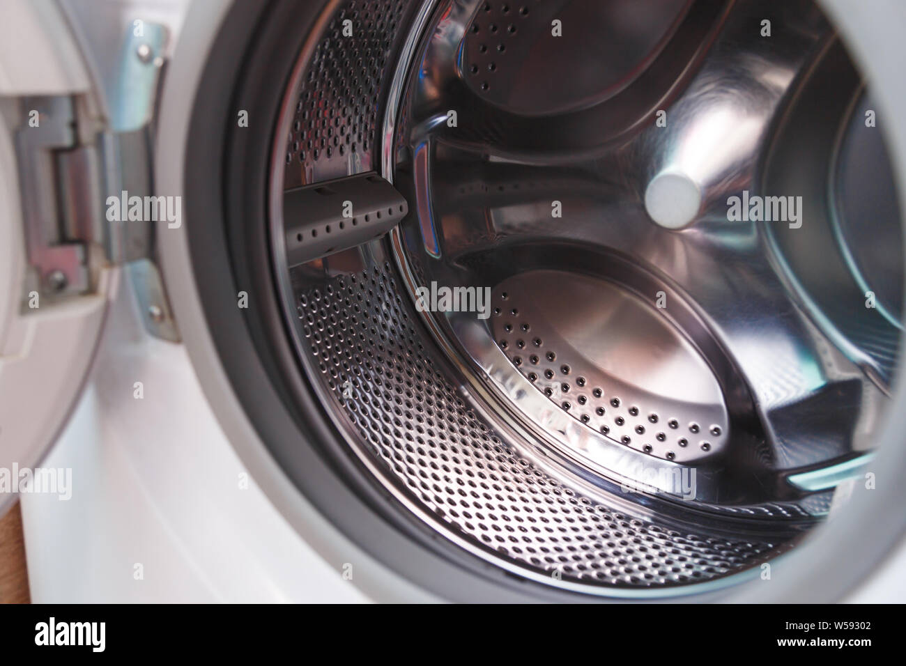 Domestic washing machine inside view. Chrome tub and drum Stock Photo ...