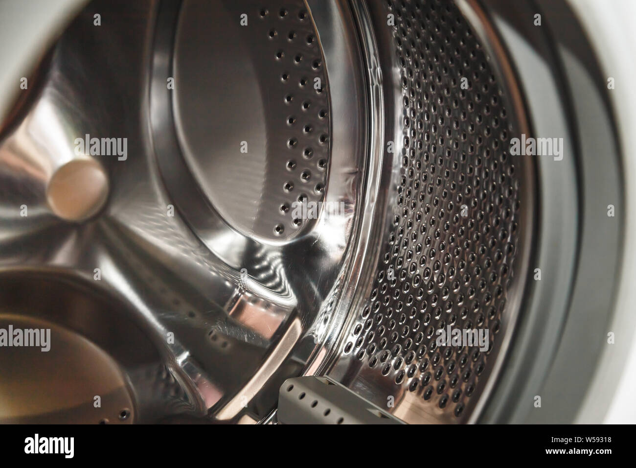 Domestic washing machine inside view. Chrome tub and drum Stock Photo ...