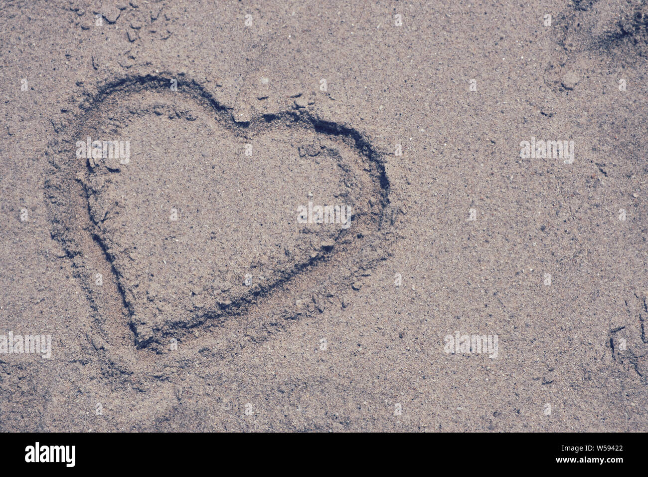heart shape in the sand at a beach Stock Photo - Alamy