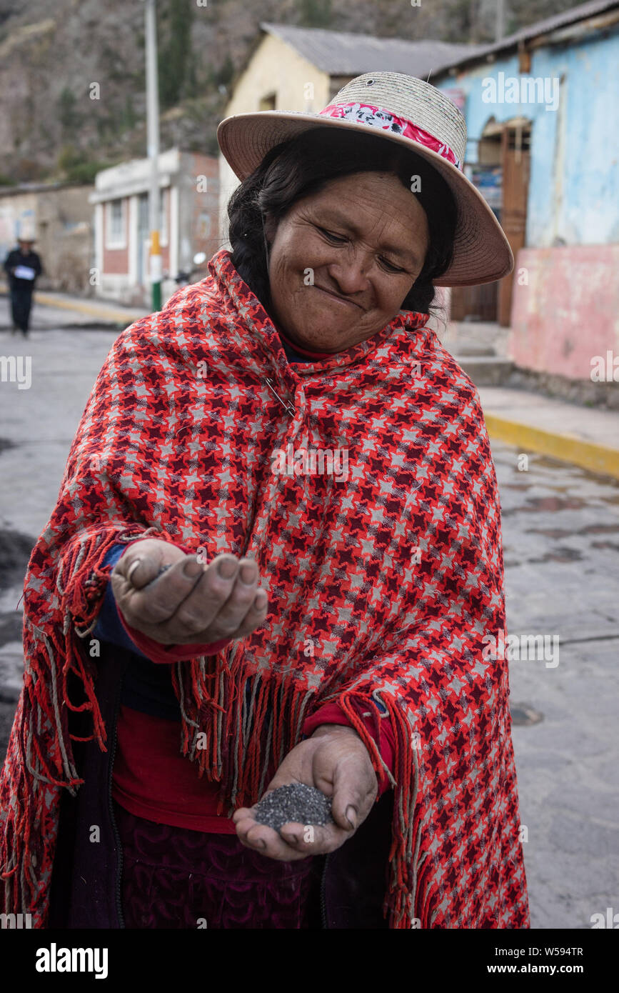 Lima, Peru. 26th July, 2019. A woman shows ashes ejected from the ...