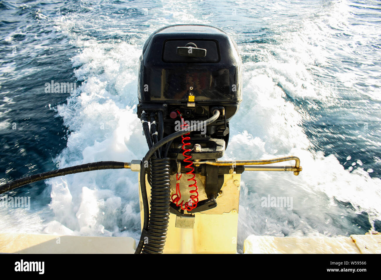 Black and powerful outboard engine of the boat showing his power over ...