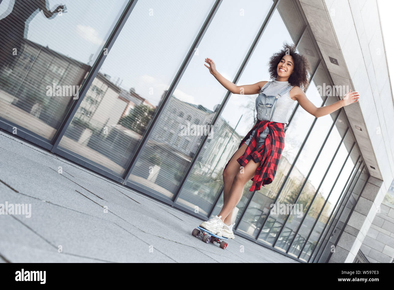 Riding penny board hi-res stock photography and images - Alamy