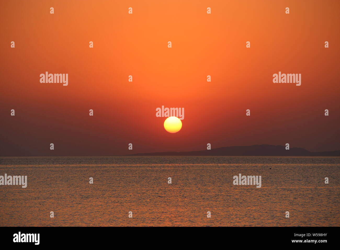 Sunset above sea. Beautiful summer decline above ocean. Beautiful ...