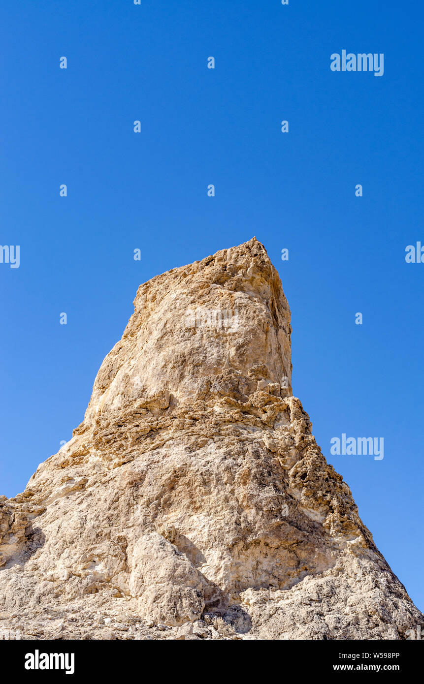 Top of light blue pinnacle reaching for the blue sky Stock Photo - Alamy