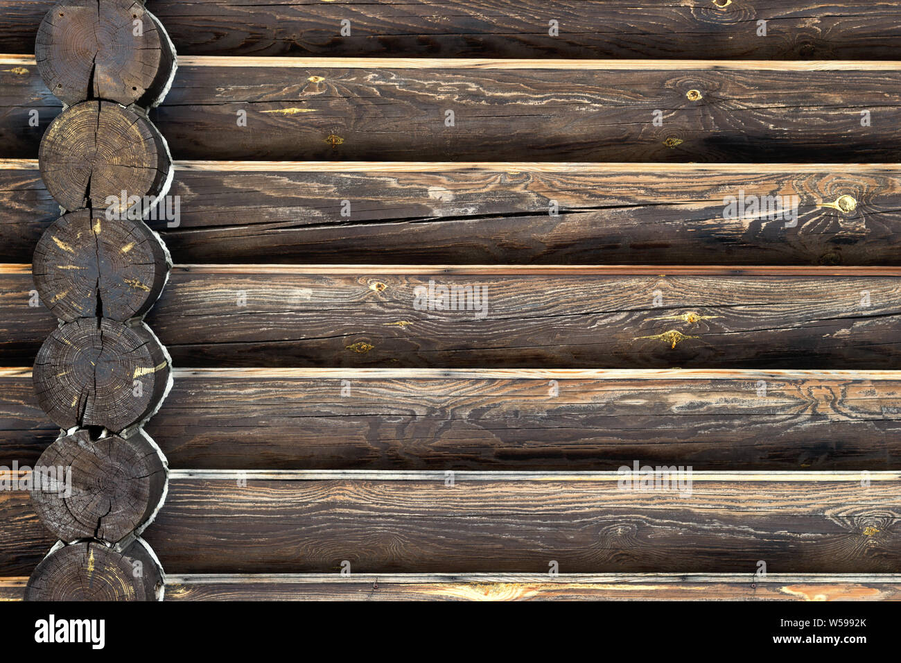 Timber house wall from wood logs. Background with copy space. Close-up ...