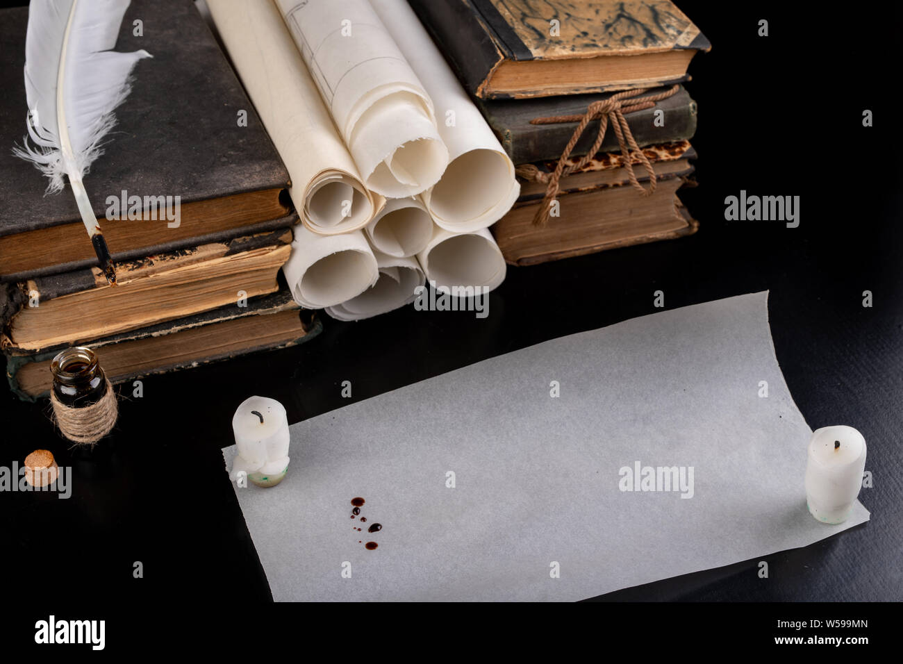 Feathers of birds for writing and calligraphy on old paper. A place for ...