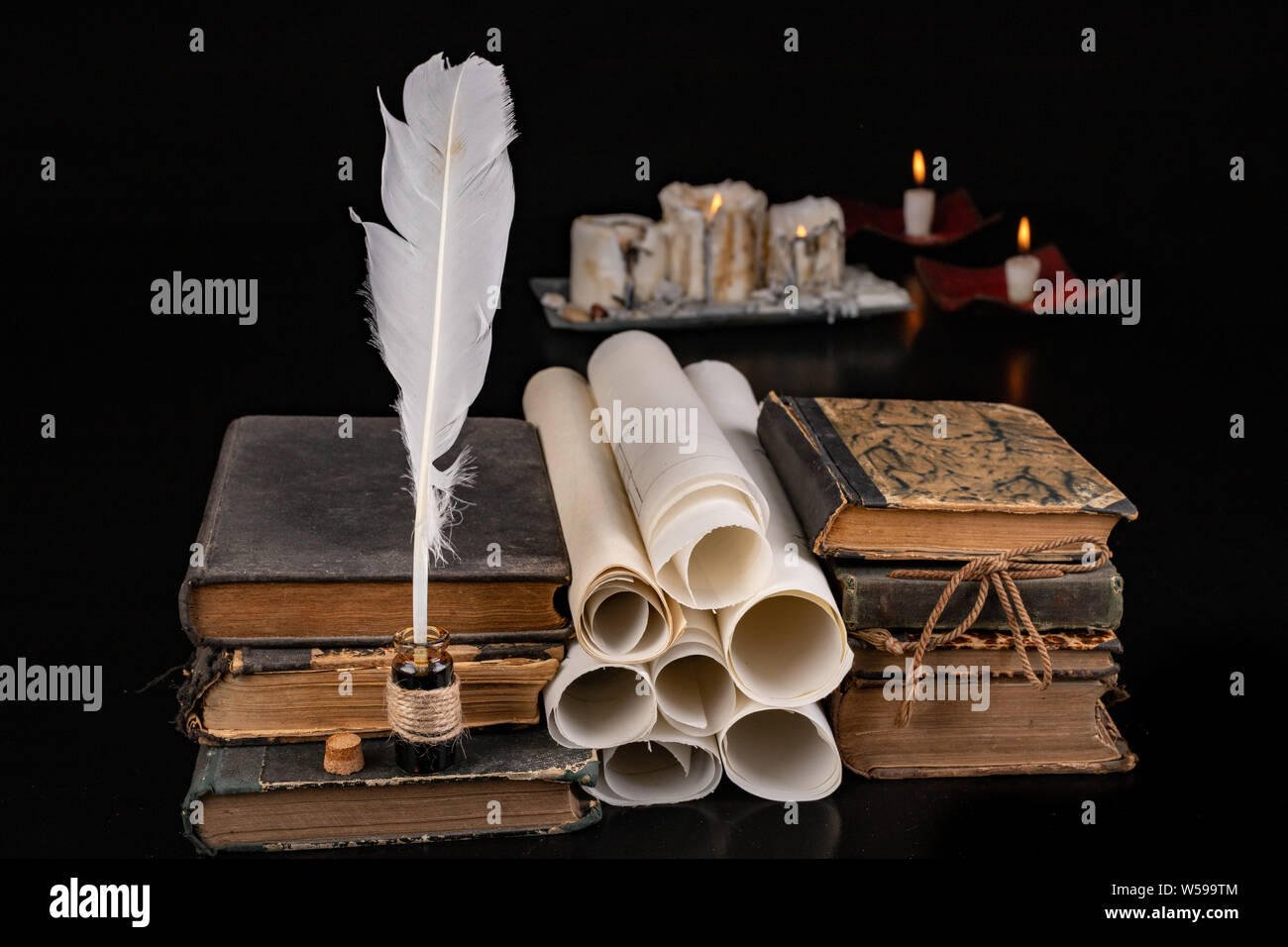 Feathers of birds for writing and calligraphy on old paper. A place for ...