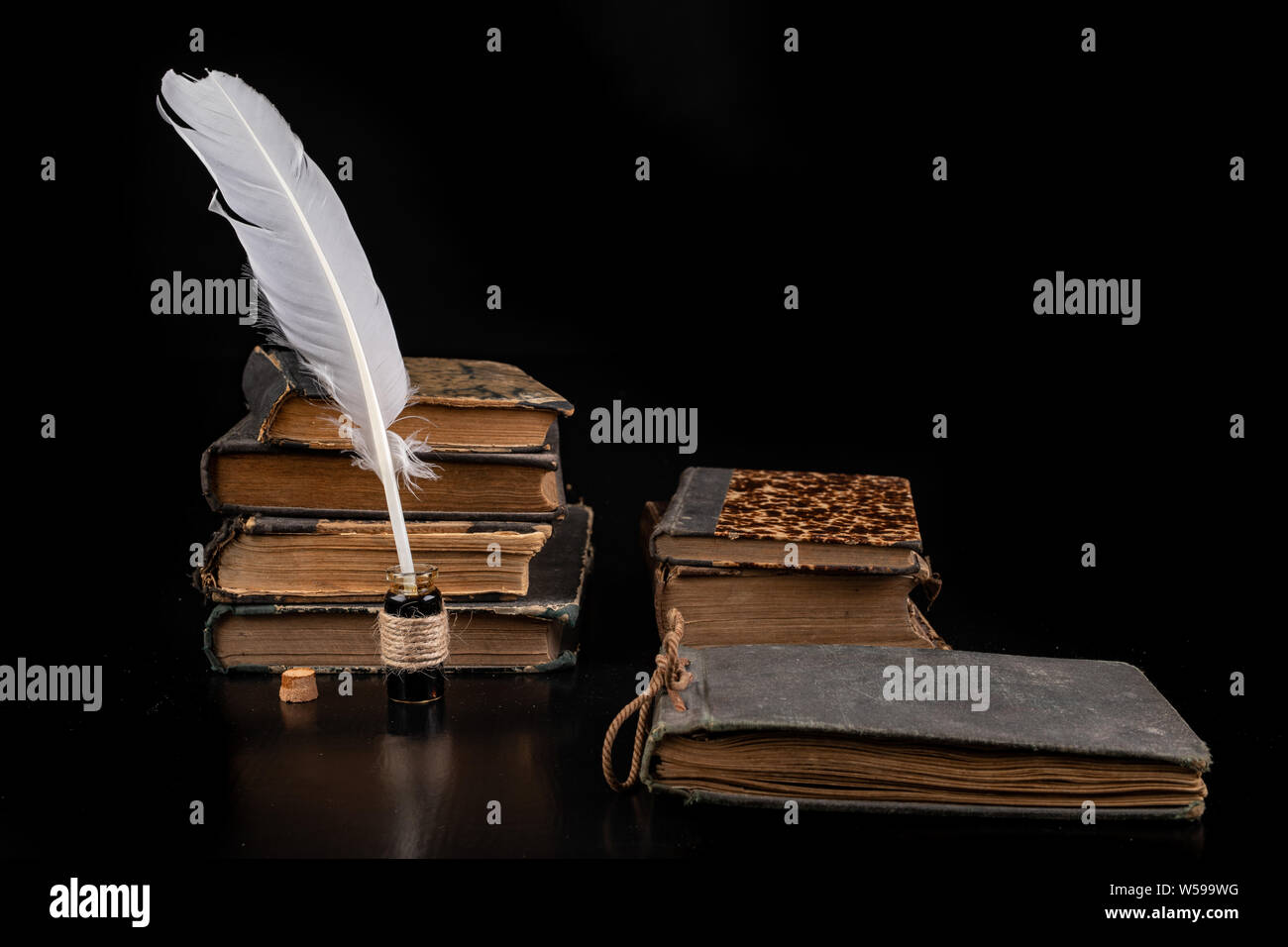 Feathers of birds for writing and calligraphy on old paper. A place for ...