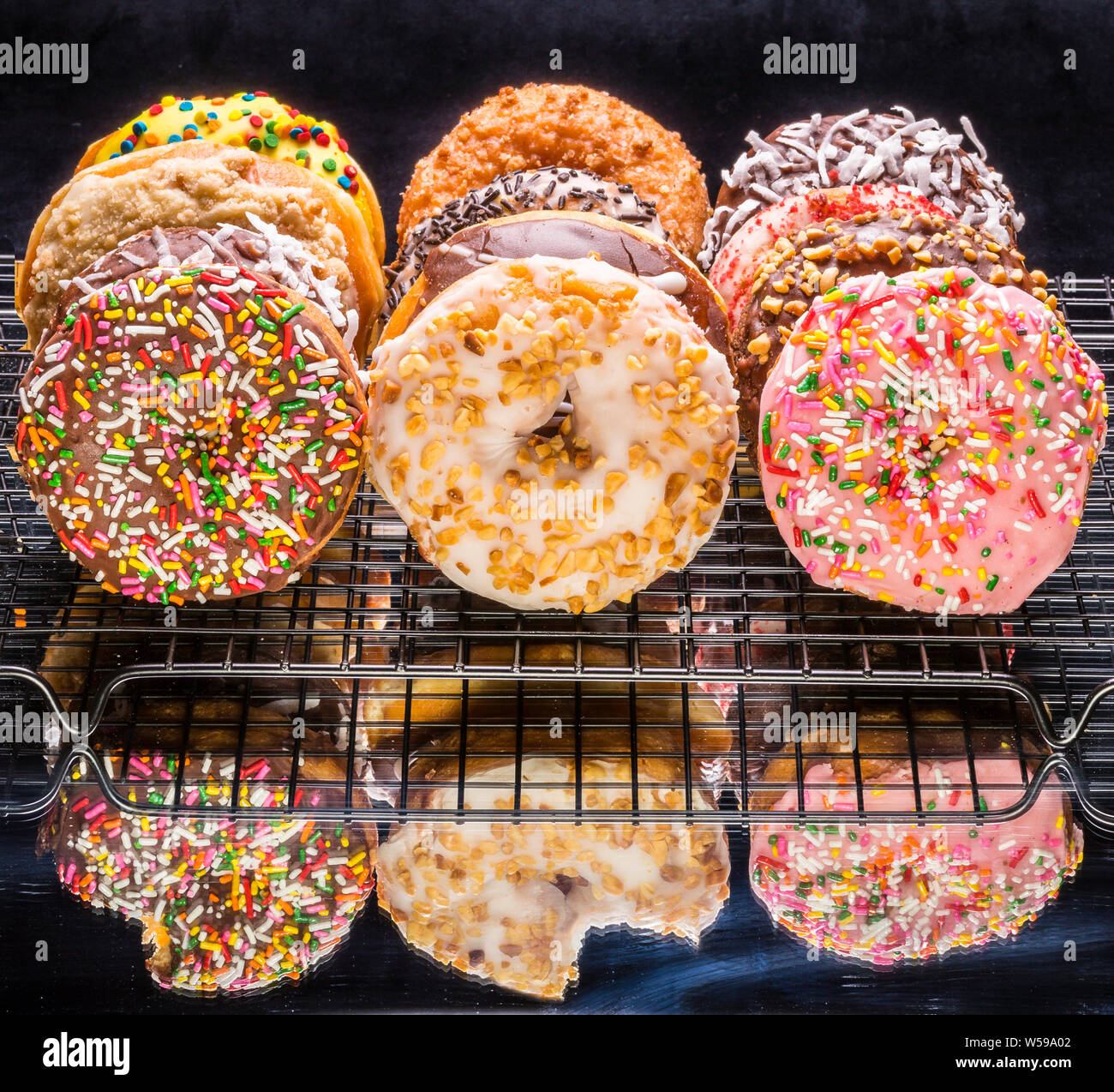donut reflected incorrectly in mirror on metal rack Stock Photo - Alamy