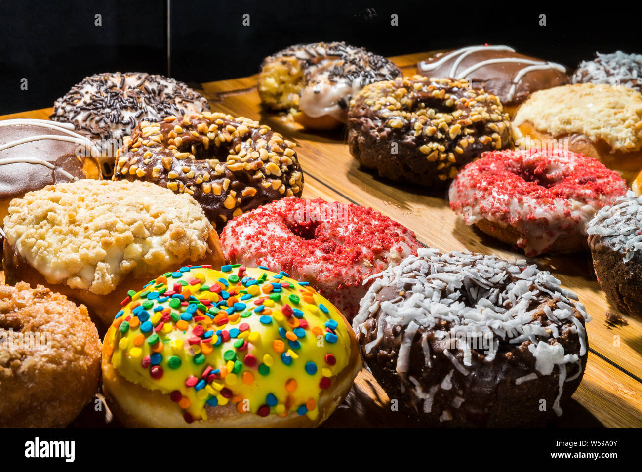 donut reflected incorrectly in mirror on wooden cutting board Stock ...