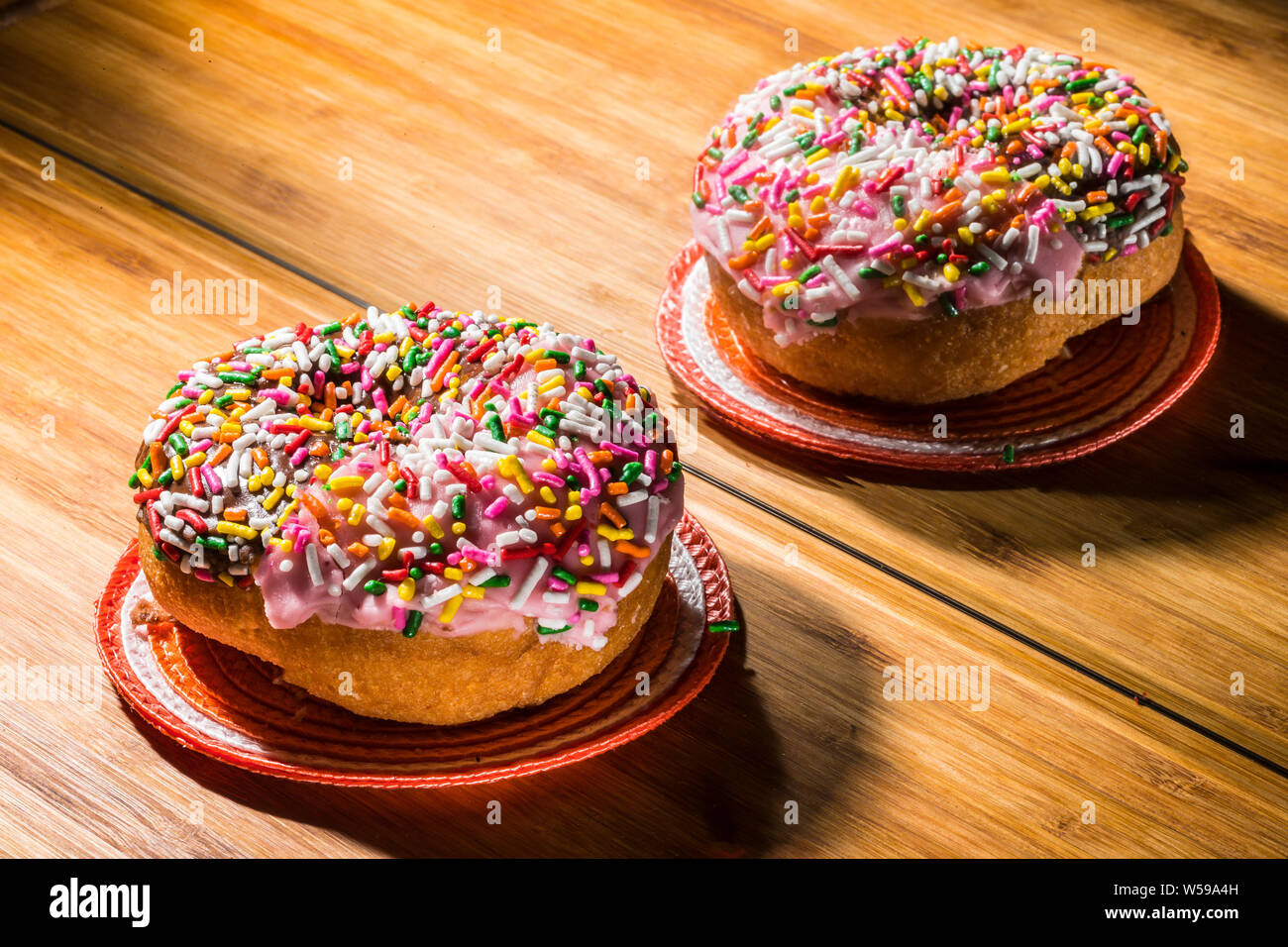 donut reflected incorrectly in mirror on wooden cutting board Stock ...