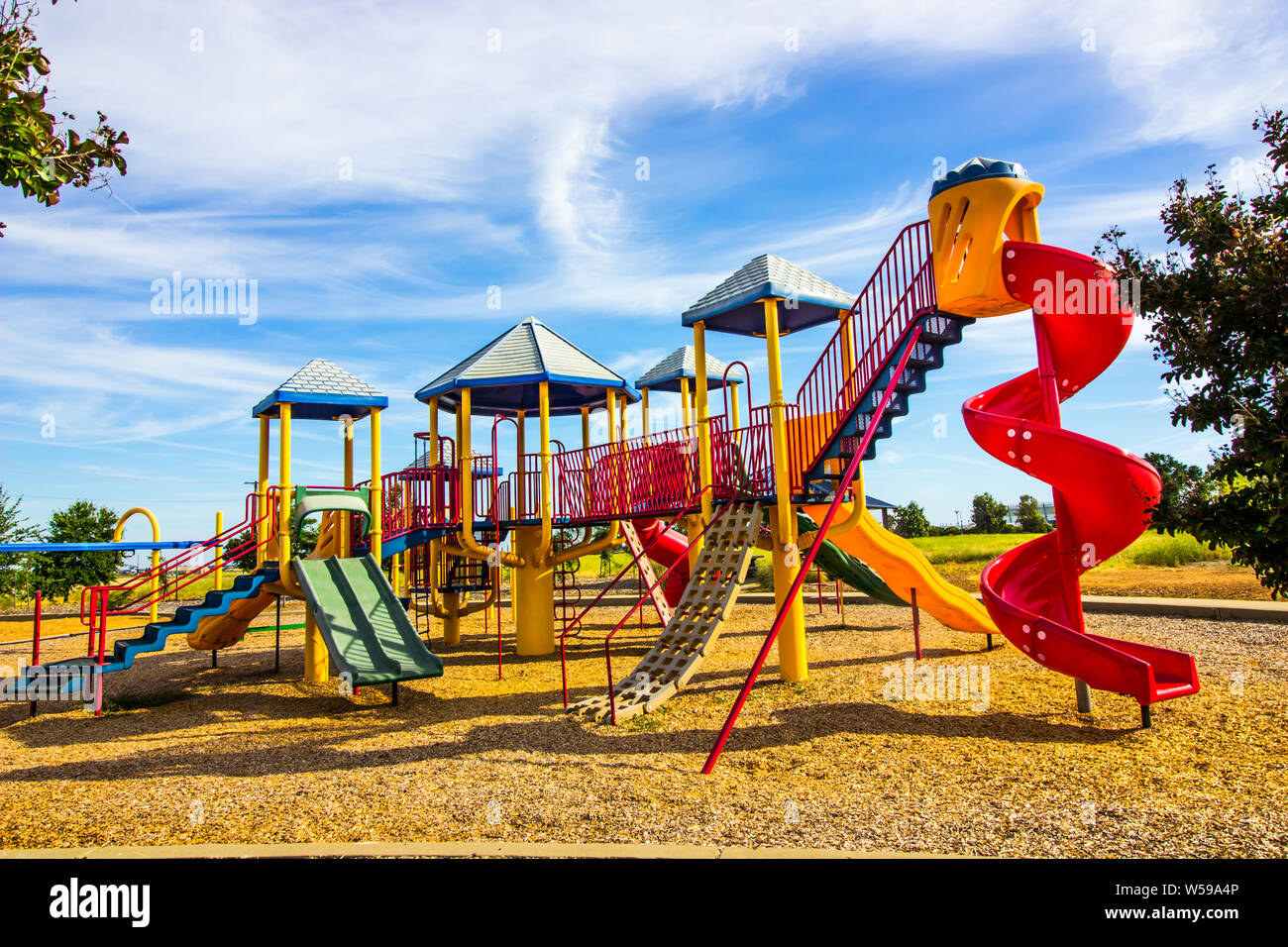 Children's Playground Equipment With Multiple Slides Stock Photo - Alamy