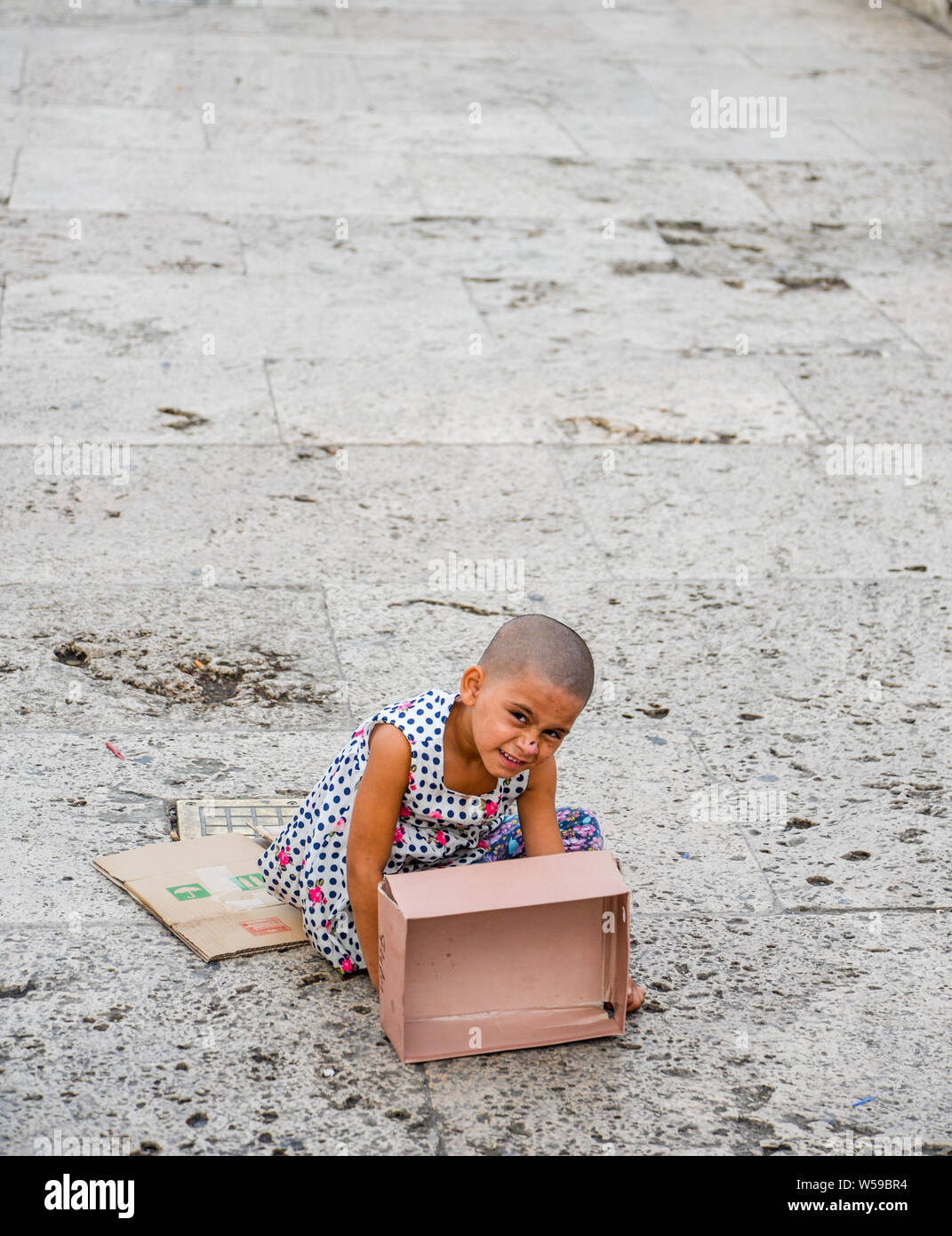 The young beggar hi-res stock photography and images - Alamy