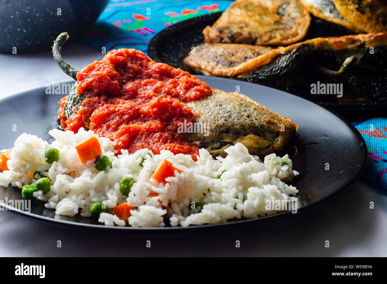 Mexican stuffed chili (Chiles Rellenos), poblano chili filled with ...
