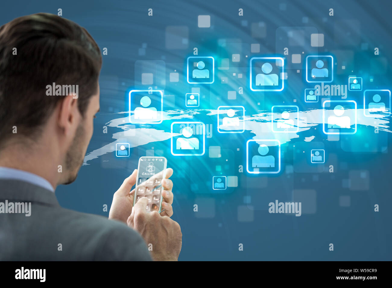 Man holding futuristic smart phone and calling his friends all over the ...