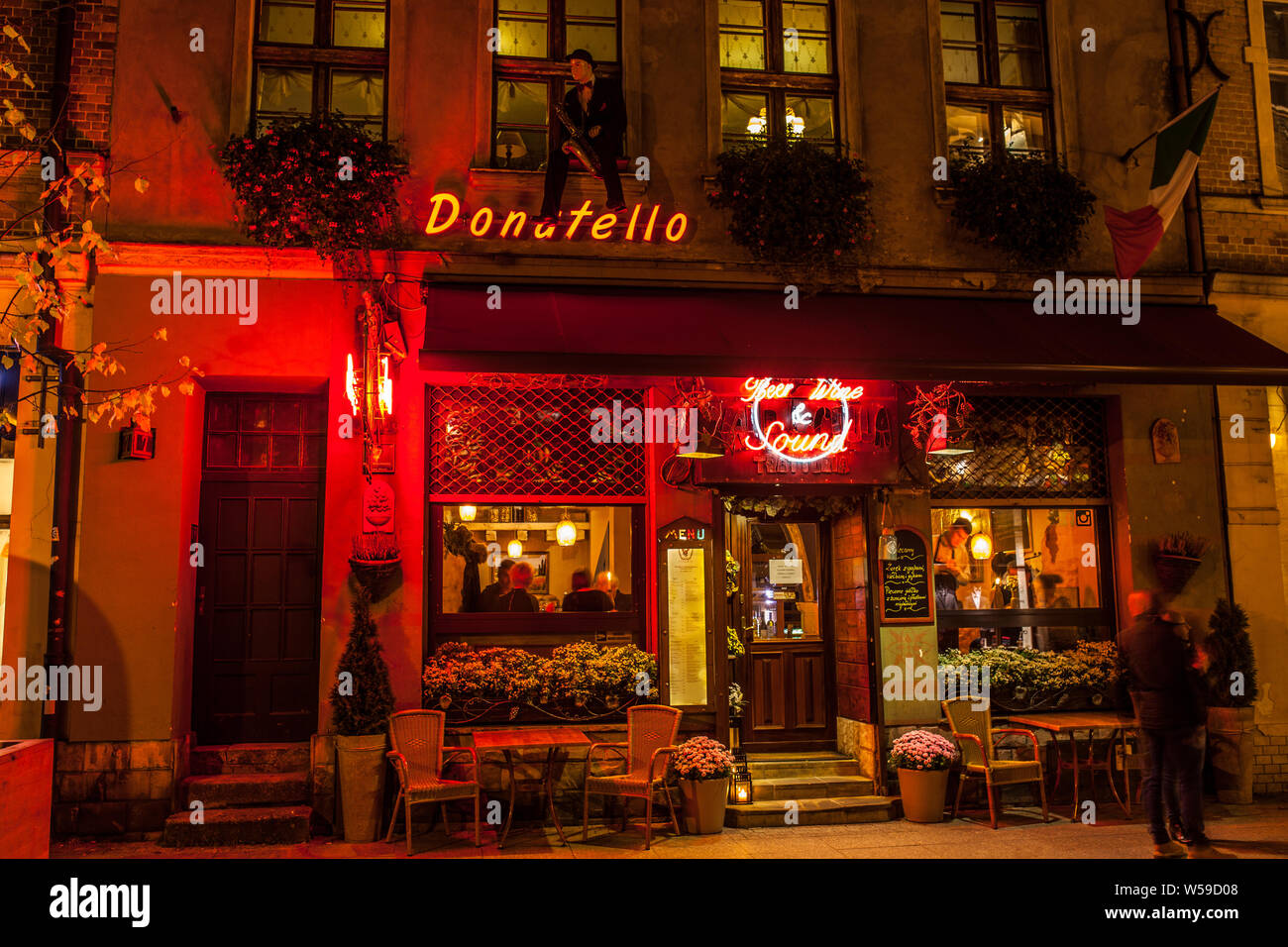 Poznan, Poland, Nov 2017: old Market Square at night, restaurant, bar ...