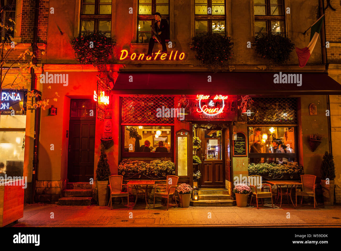 Poznan, Poland, Nov 2017: old Market Square at night, restaurant, bar ...