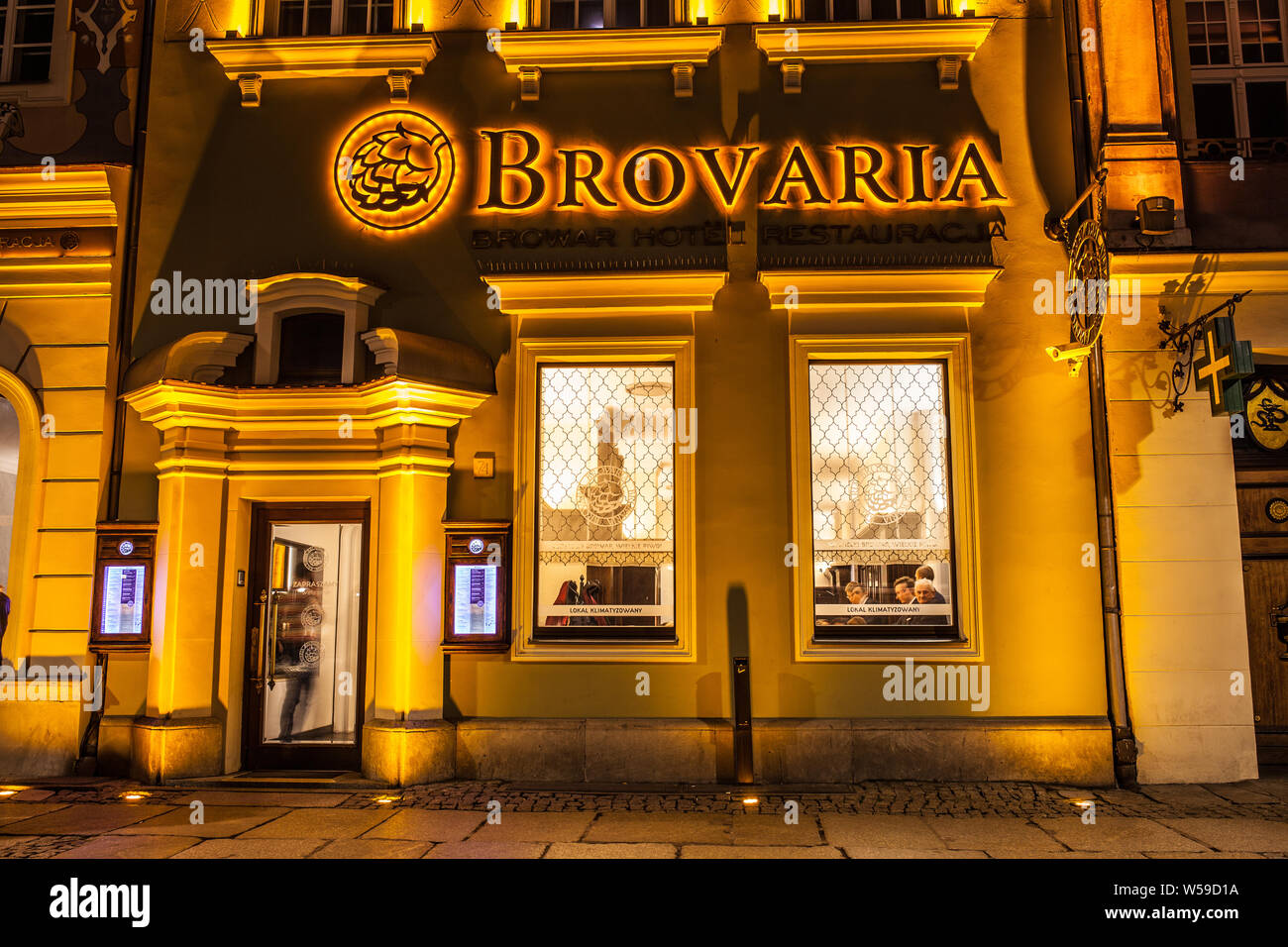 Poznan, Poland, Nov 2017: old Market Square at night, restaurant, bar ...