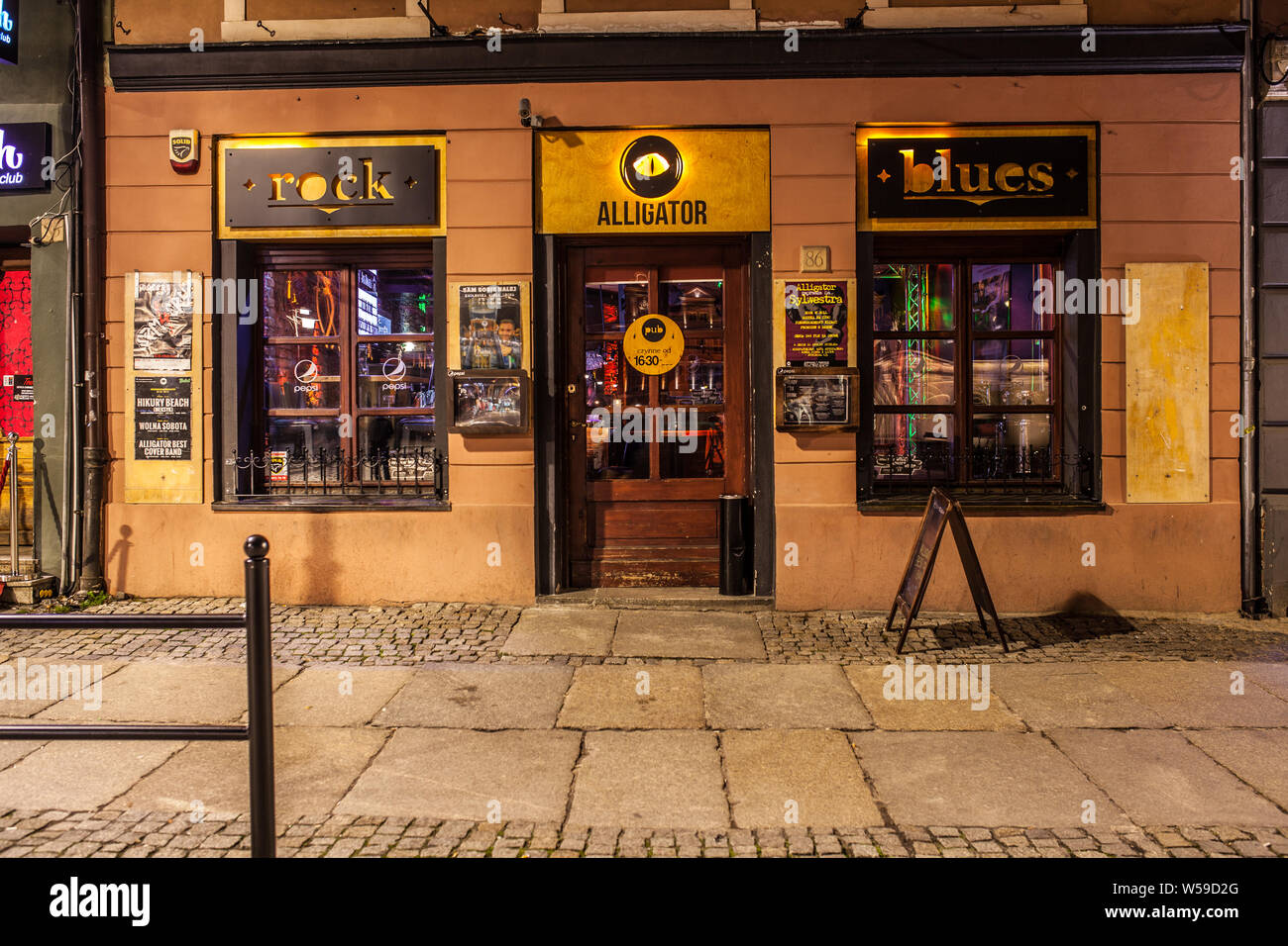Poznan, Poland, Nov 2017: old Market Square at night, restaurant, bar ...