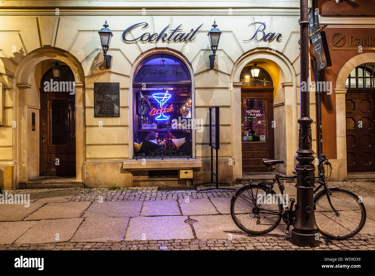 Poznan, Poland, Nov 2017: old Market Square at night, restaurant, bar ...