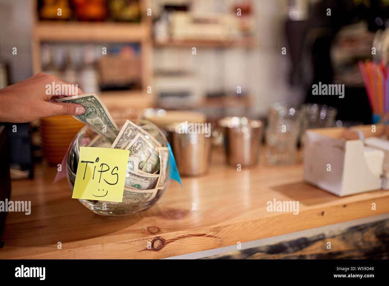 Tips - Money left for a employee in coffee shop Stock Photo - Alamy